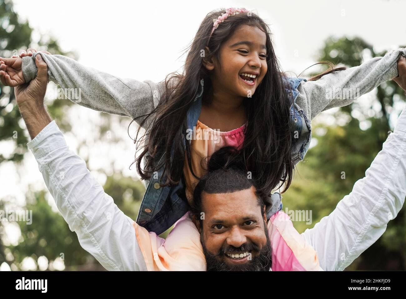 Happy Indian Father Having Fun With Her Daughter Outdoor Focus On