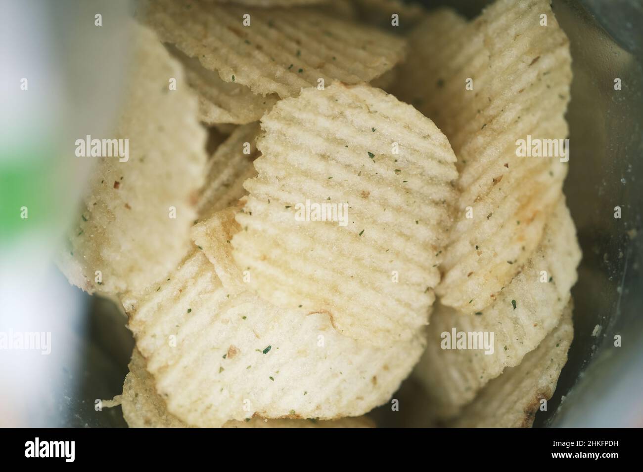 holding a open potato chips packet top view Stock Photo - Alamy