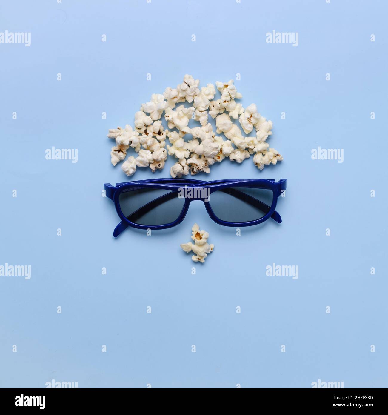 Pop Corn man face on blue background. Cinema concept. Top view flat lay ...