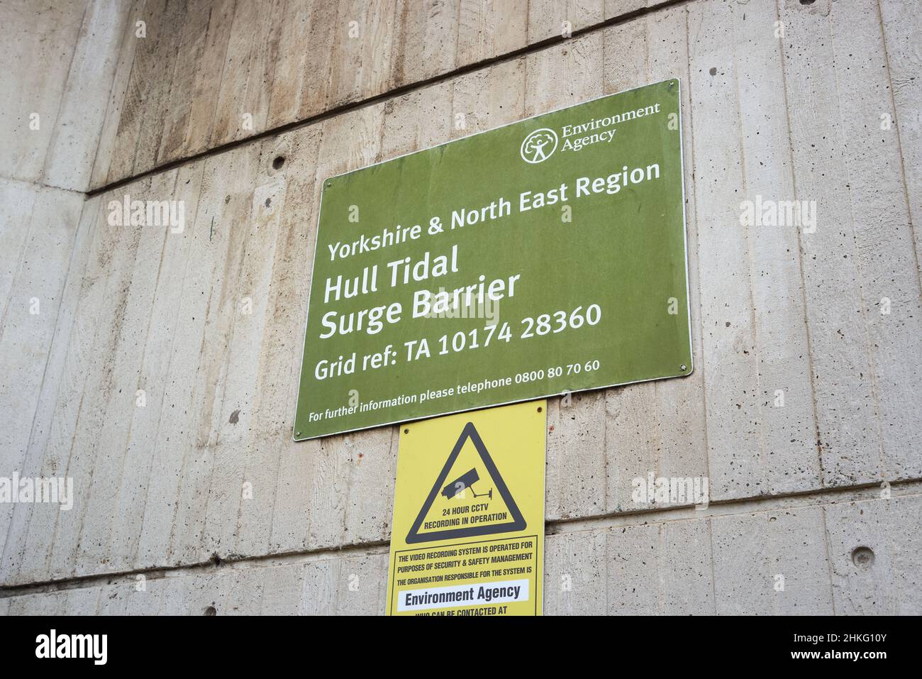 Green notice on a concrete wall Stock Photo - Alamy