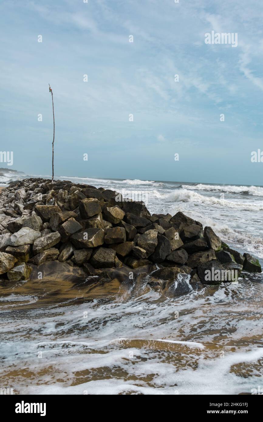 Black sand beach barricade, Kappil, Kerala Stock Photo - Alamy