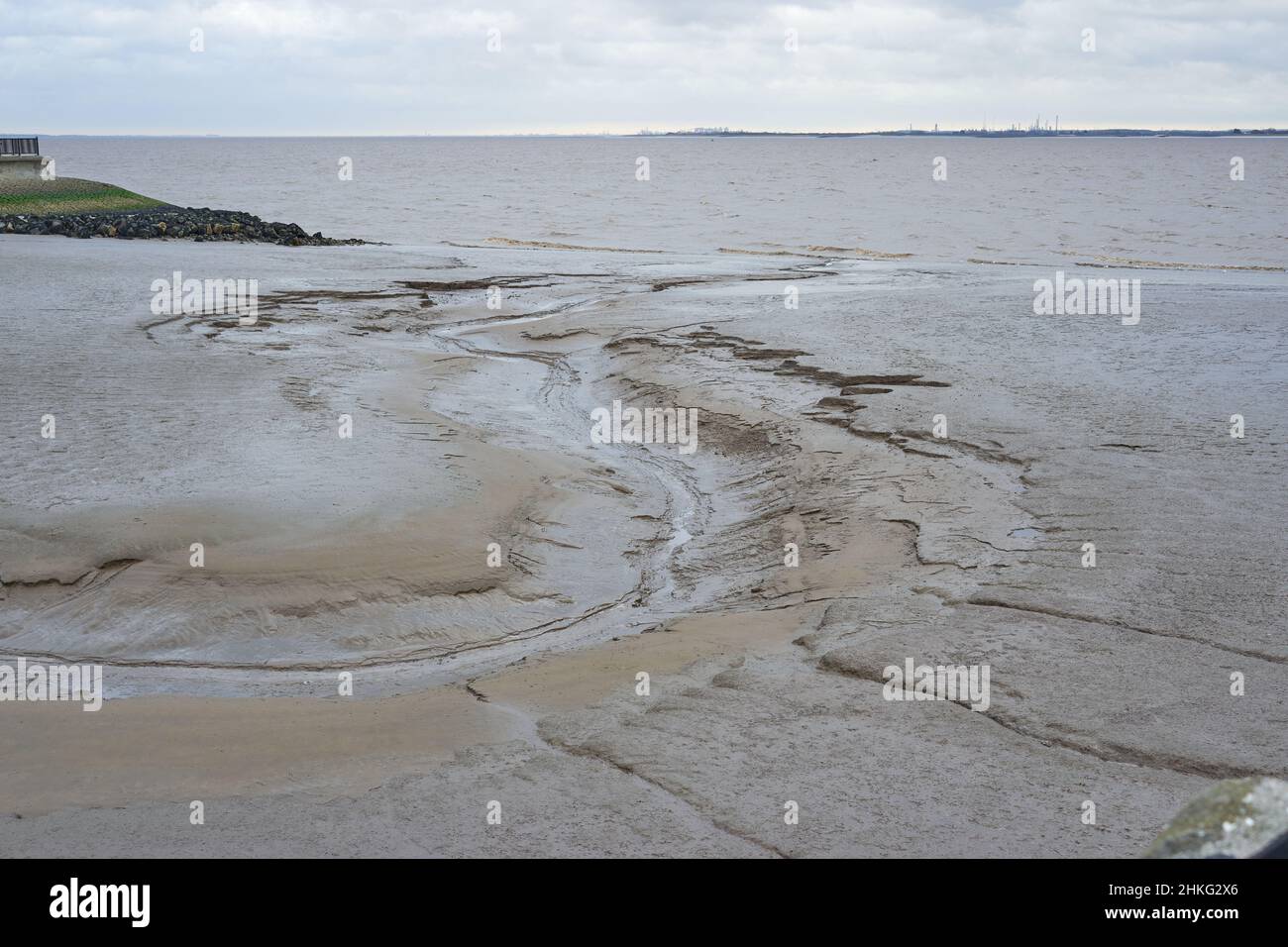 Muddy bay at low tide Stock Photo - Alamy