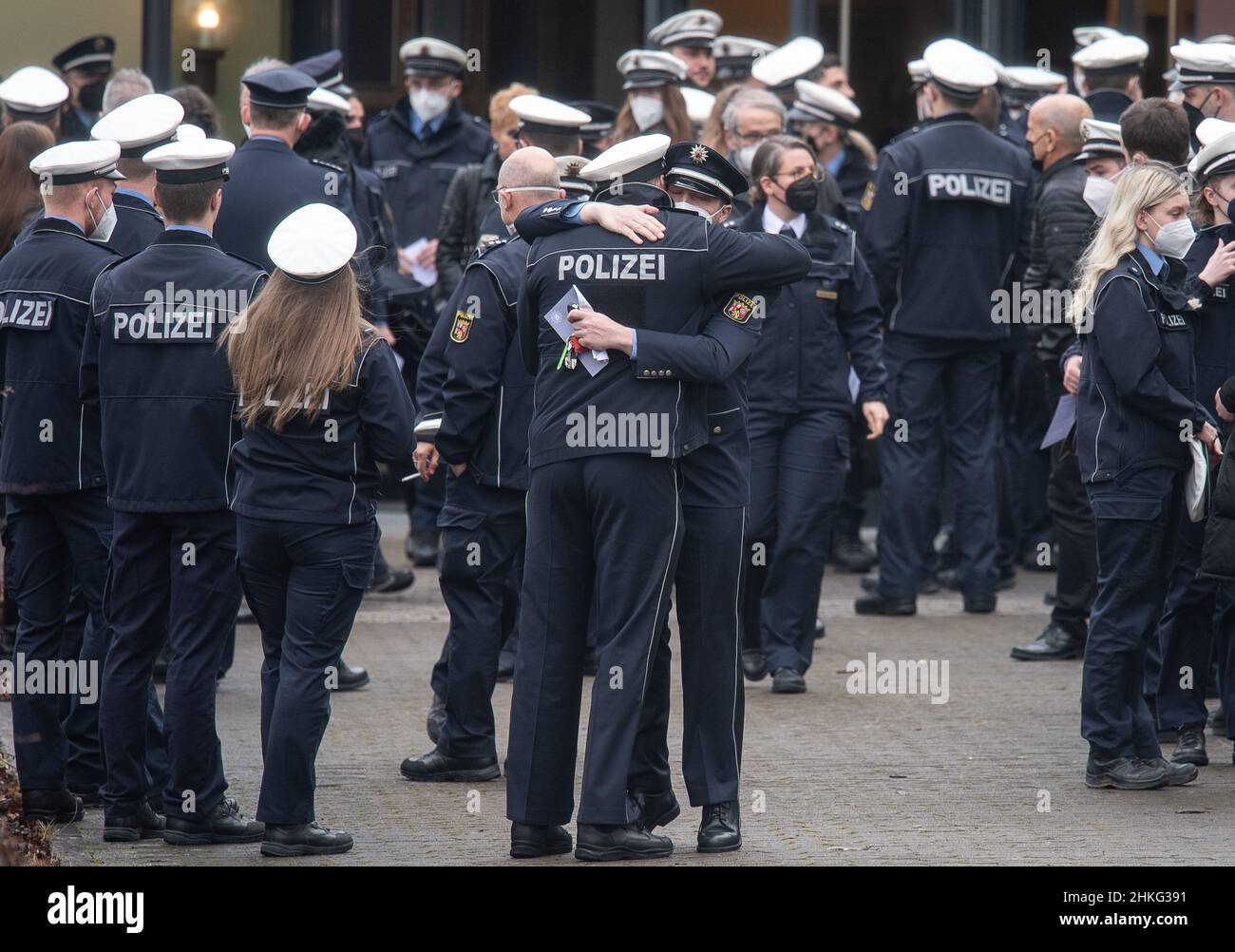 Kusel, Germany. 04th Feb, 2022. Police officers hug each other after ...