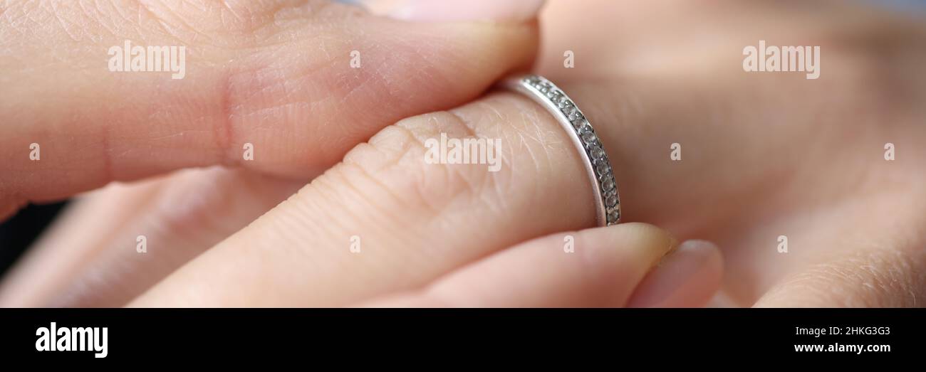 Woman putting on silver ring hi-res stock photography and images - Alamy