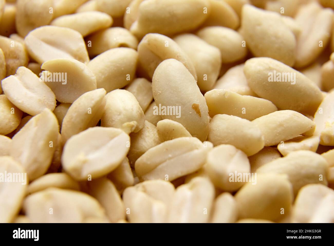 Raw blanched peanuts as food background closeup Stock Photo - Alamy