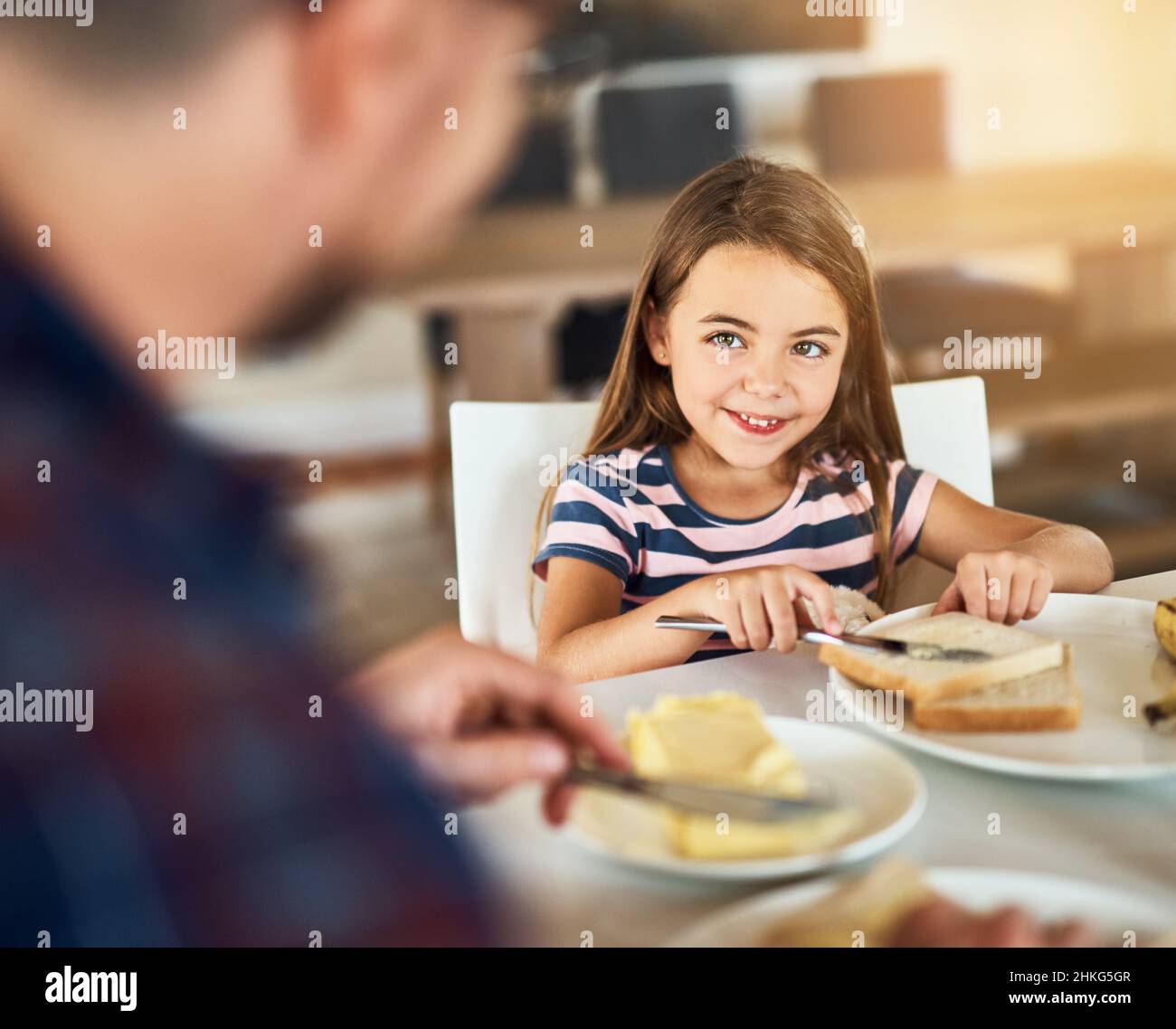 Thanks for breakfast, dad. Cropped shot of an adorable little girl ...