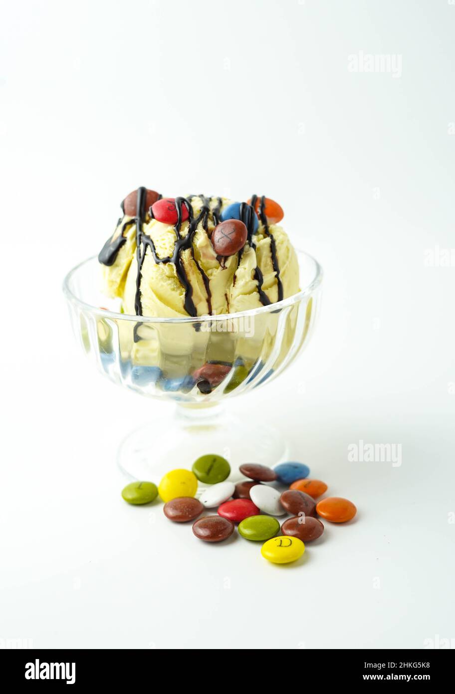 Cup of ice cream balls and colored pastilles Stock Photo - Alamy