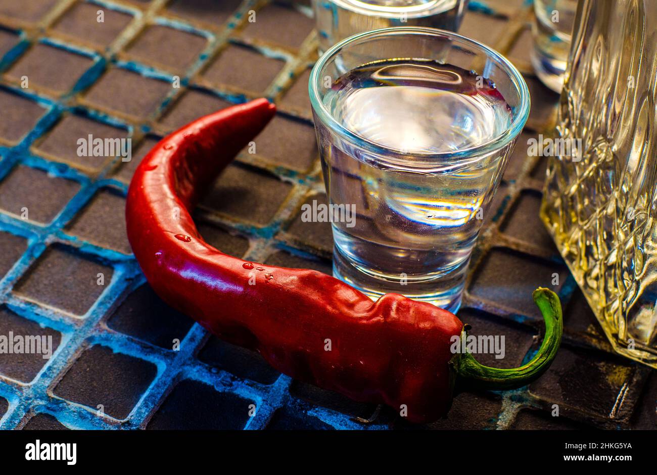 glass of vodka with hot peppers on dark background Stock Photo - Alamy