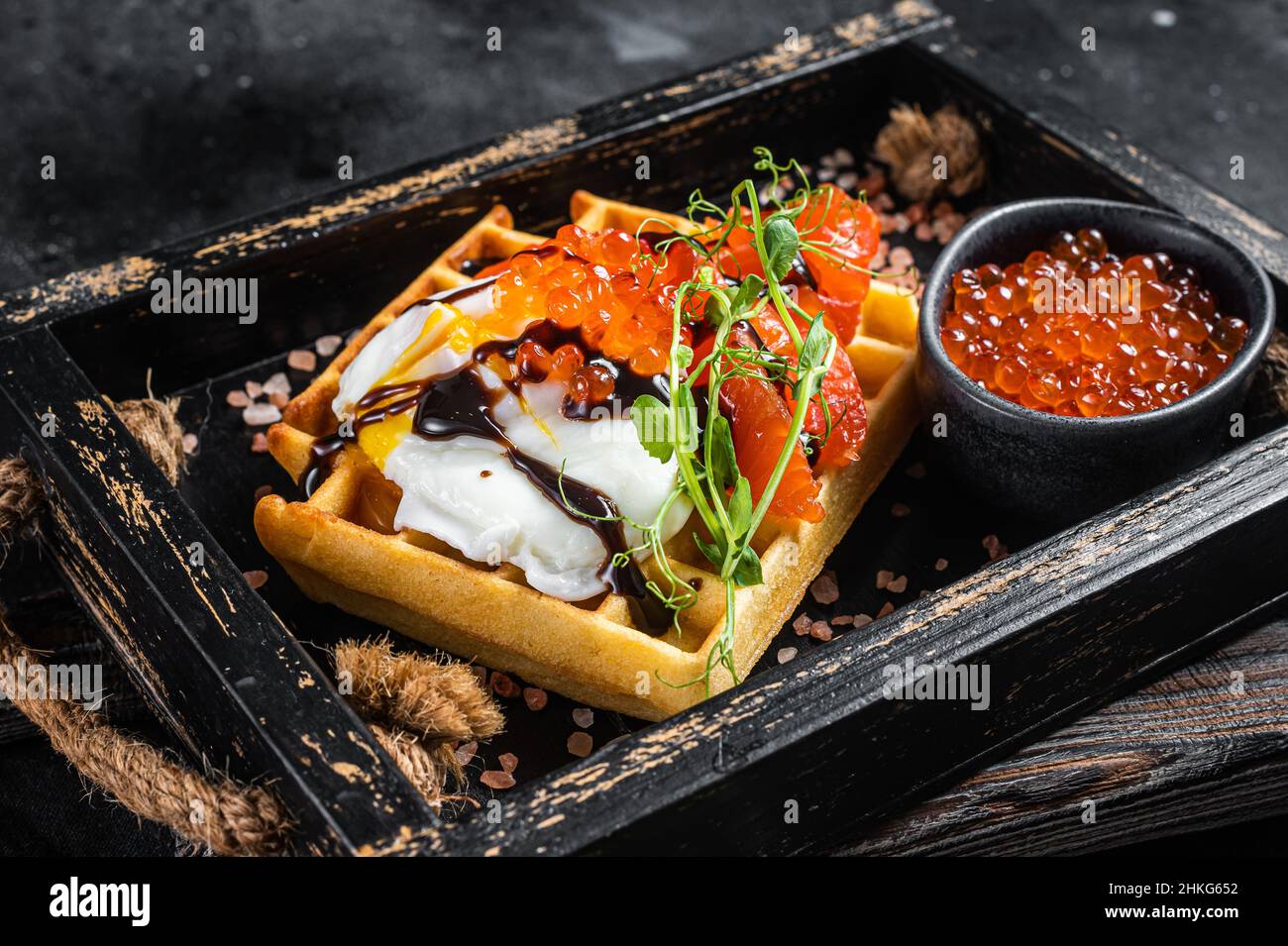 Delicious Waffle with smoked salmon fillet, poached egg and red caviar ...