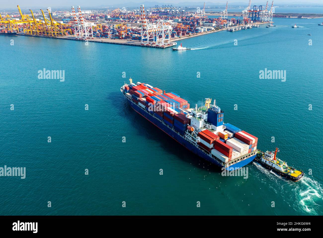 Aerial view of cargo ship and cargo container in harbor Stock Photo - Alamy