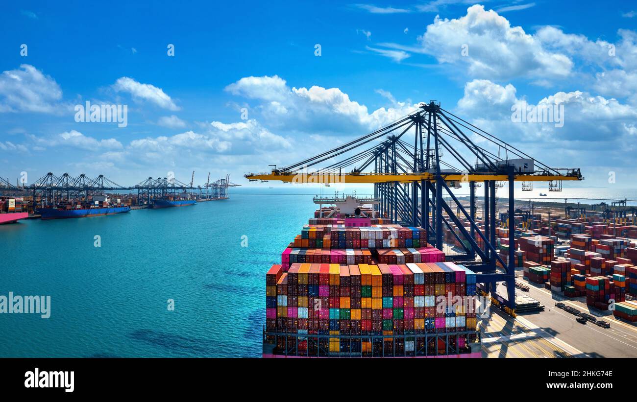 Aerial view of cargo ship and cargo container in harbor Stock Photo - Alamy