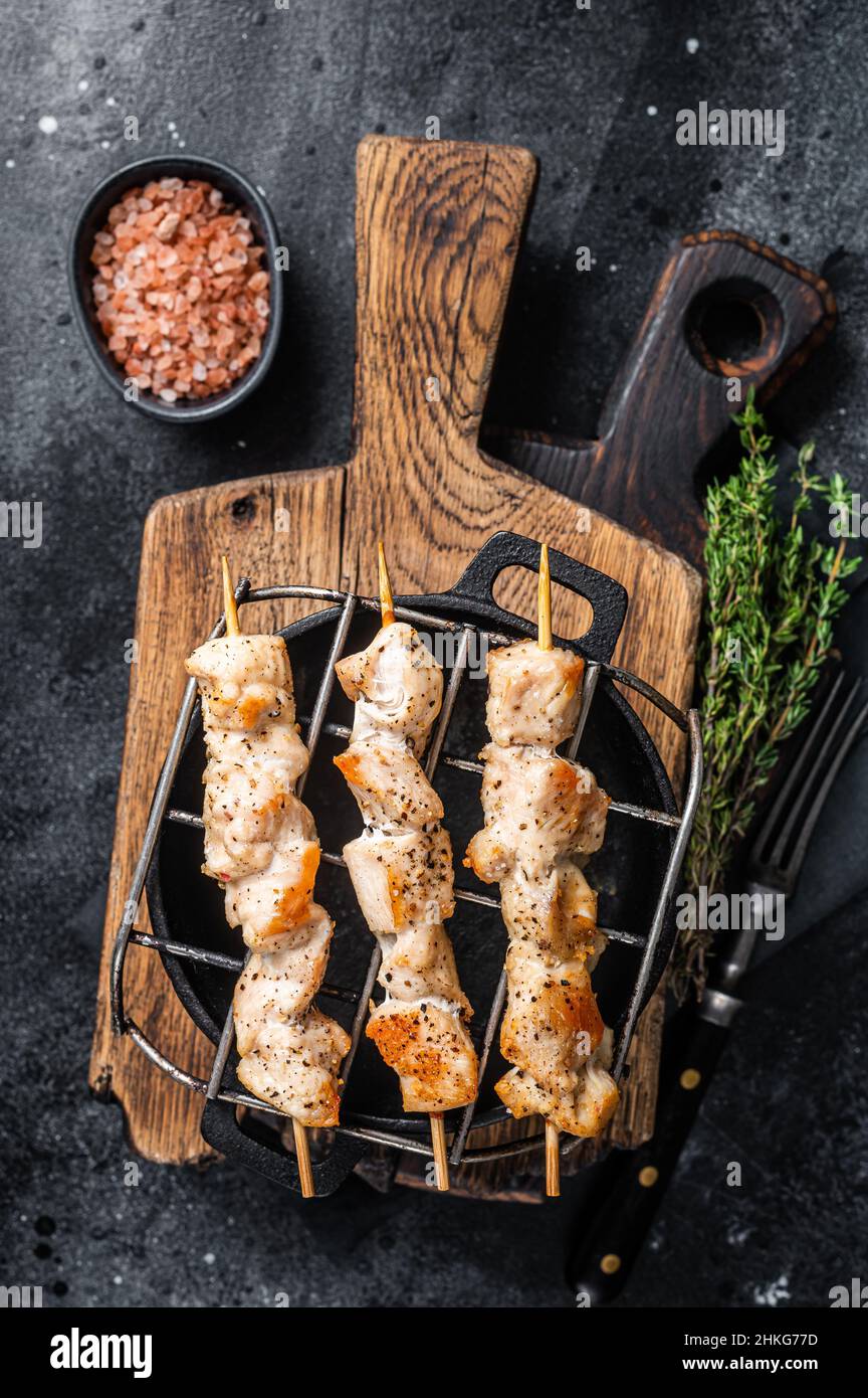 Grilled Chicken skewers souvlaki, poultry meat shish kebab. Black background. Top view Stock ...