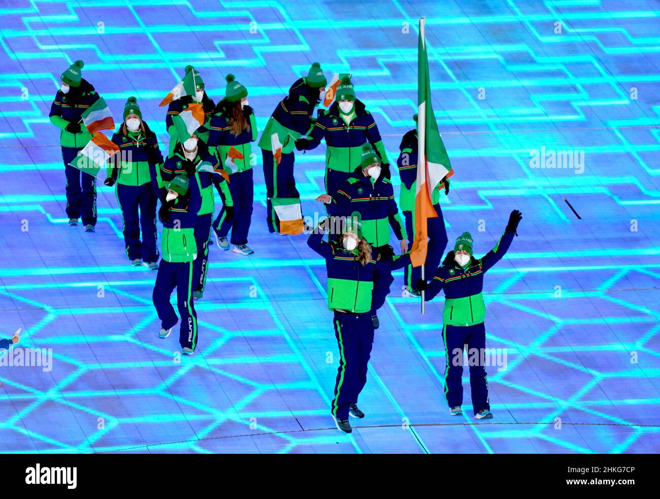 Ireland's flag bearers Brendan Newby and Elsa Desmond lead the team out ...
