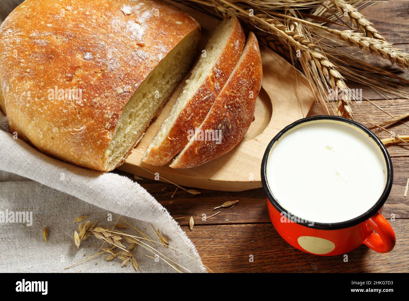 Homemade bread with milk on wooden background Stock Photo - Alamy