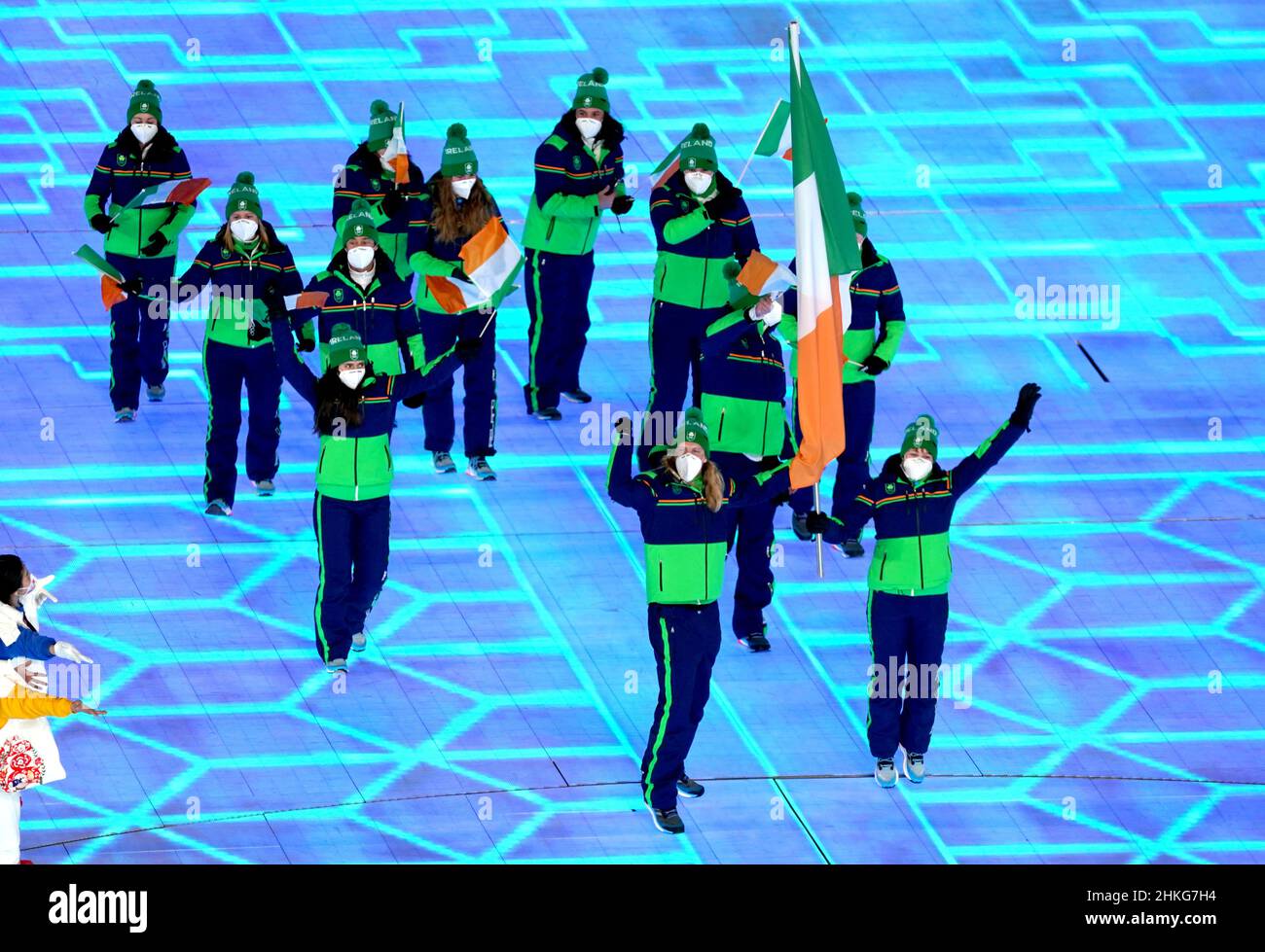 Ireland's flag bearers Brendan Newby and Elsa Desmond lead the team out ...