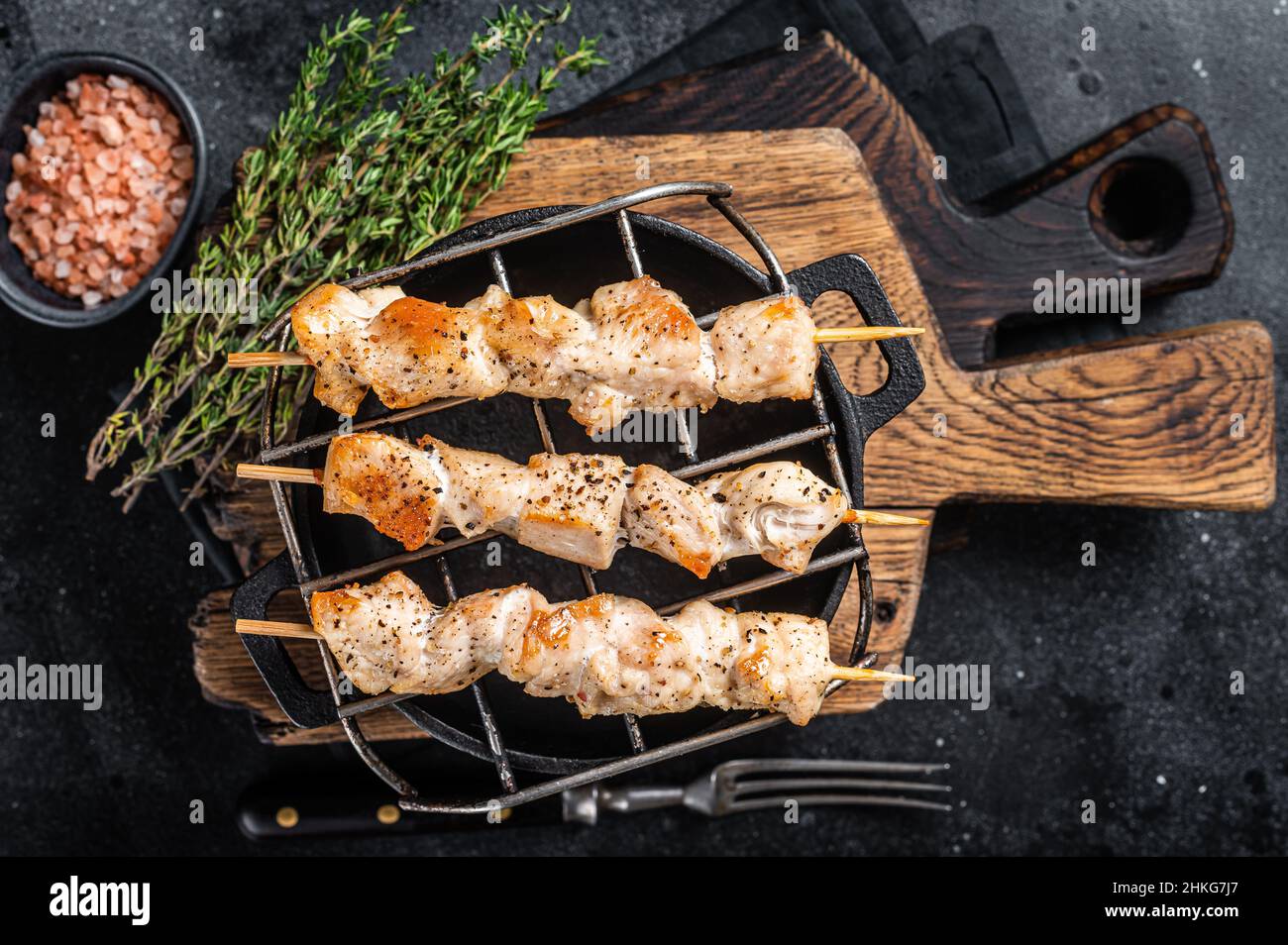 Grilled Chicken skewers souvlaki, poultry meat shish kebab. Black background. Top view Stock ...