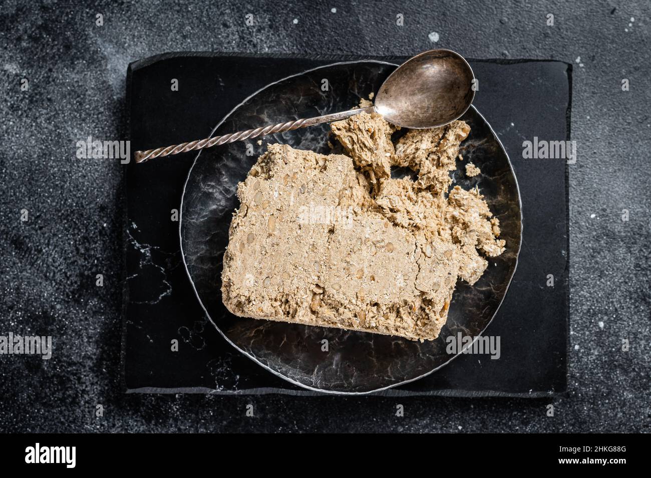 Homemade sunflower halva with honey. Black background. Top view Stock Photo - Alamy
