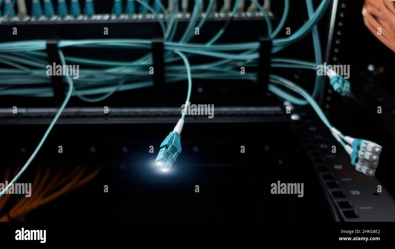 Close up fiber optic and hub in datacenter Stock Photo - Alamy