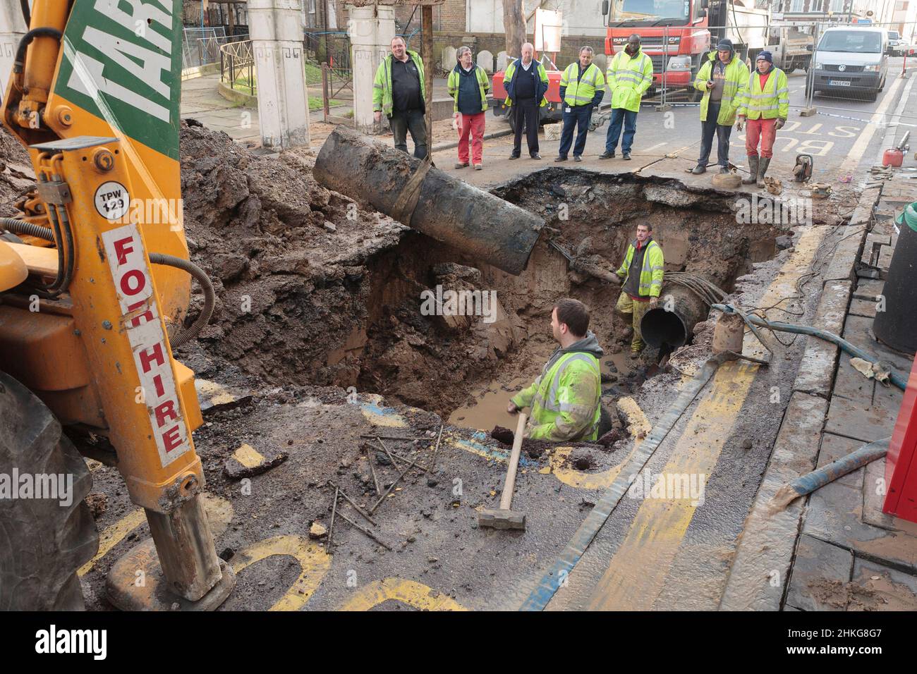 Water engineers work to repair a large Thames water main which broke at ...