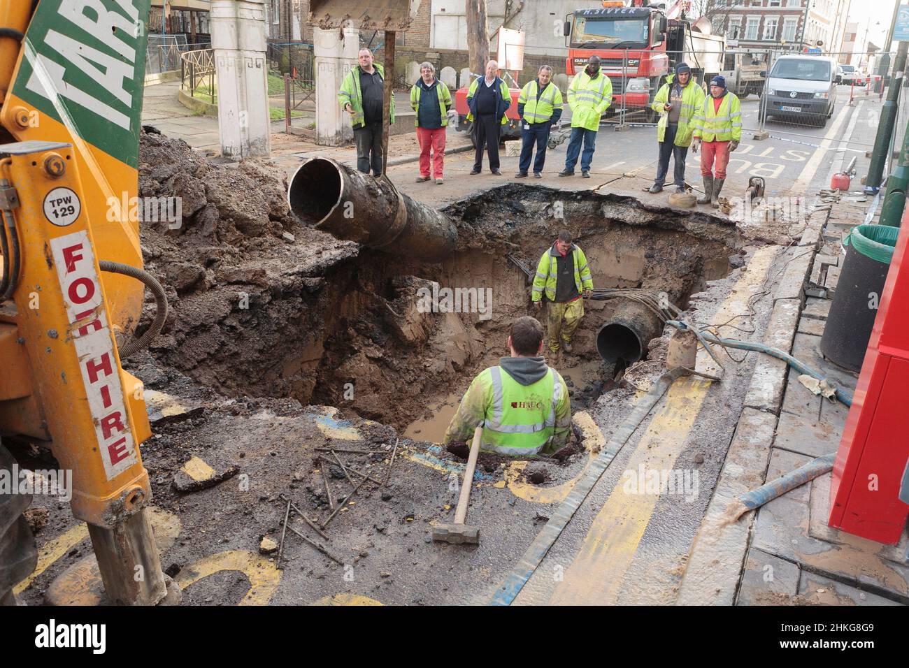 Water engineers work to repair a large Thames water main which broke at ...