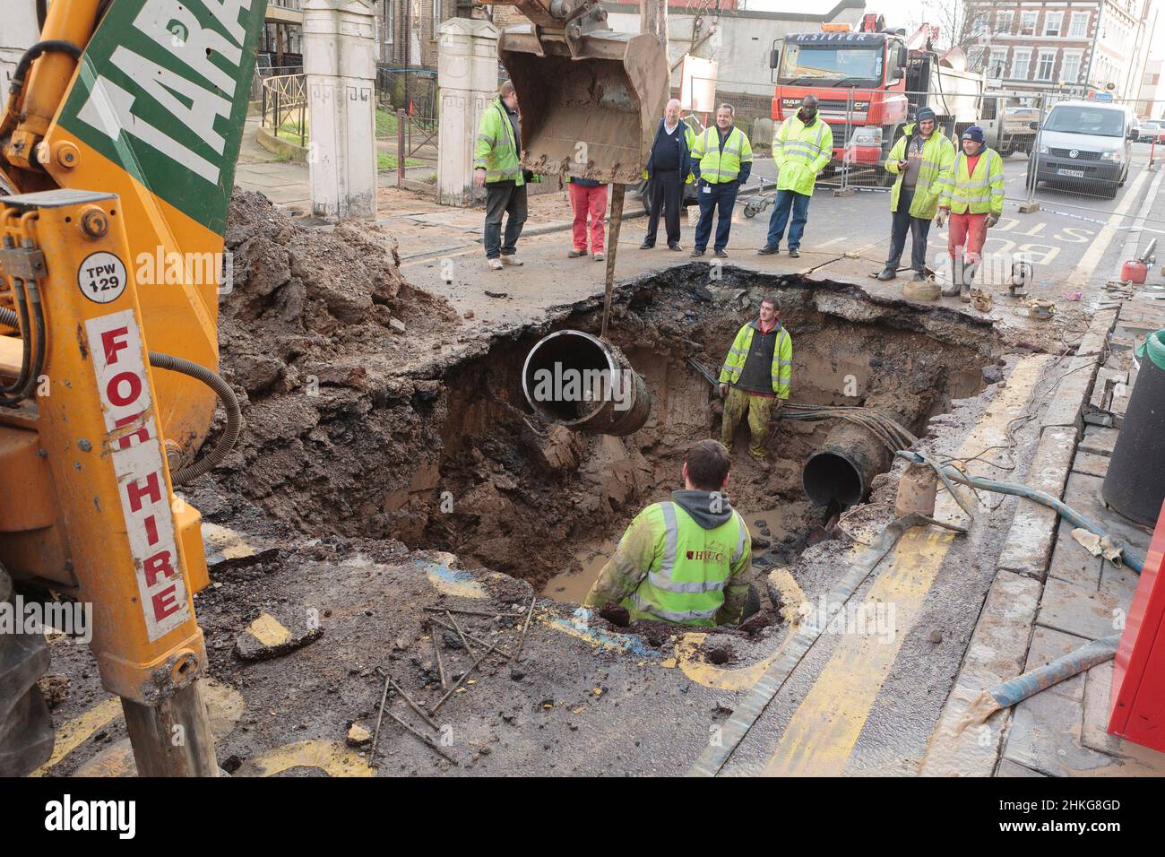 Water engineers work to repair a large Thames water main which broke at ...