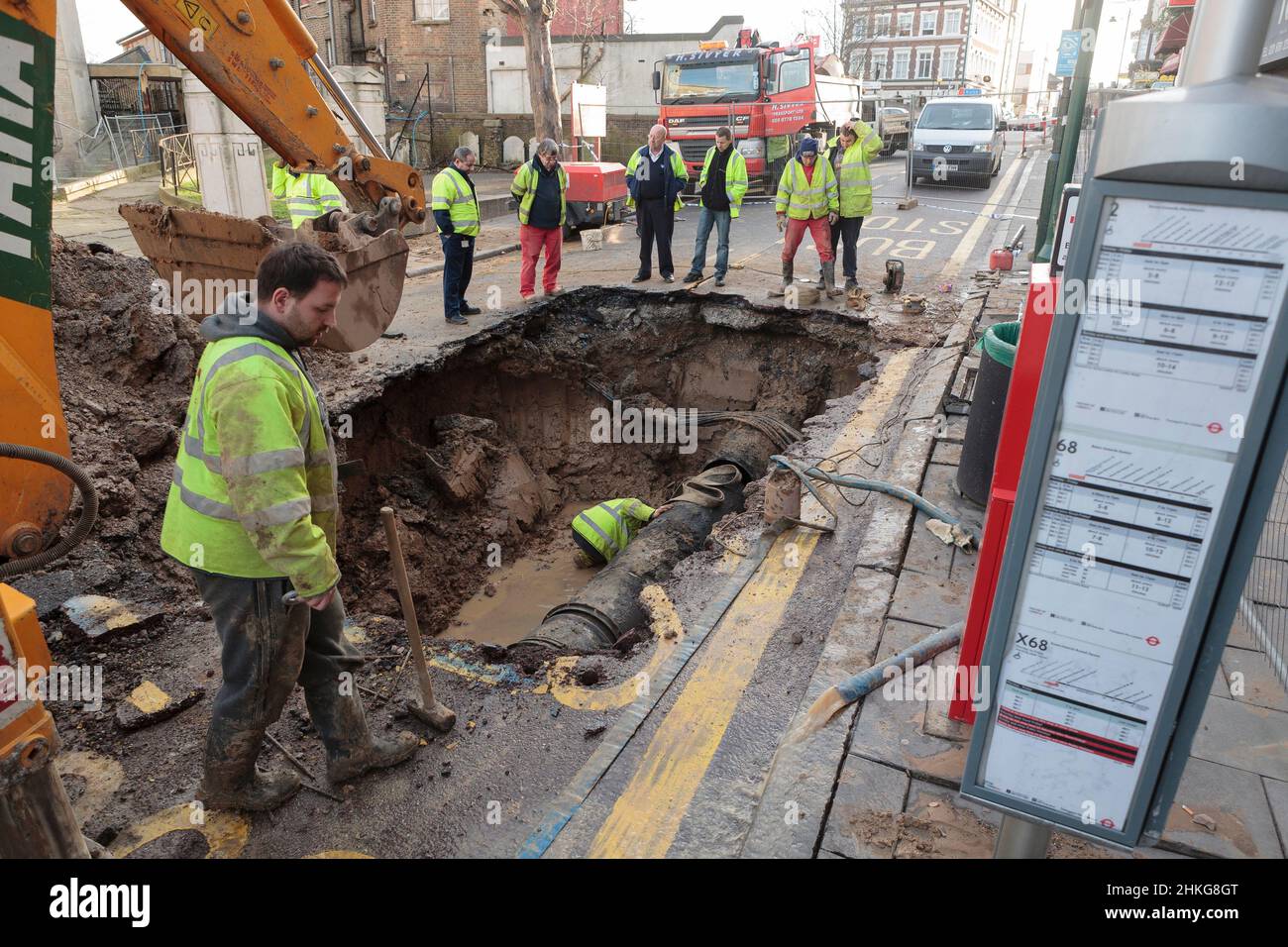 Water engineers work to repair a large Thames water main which broke at ...