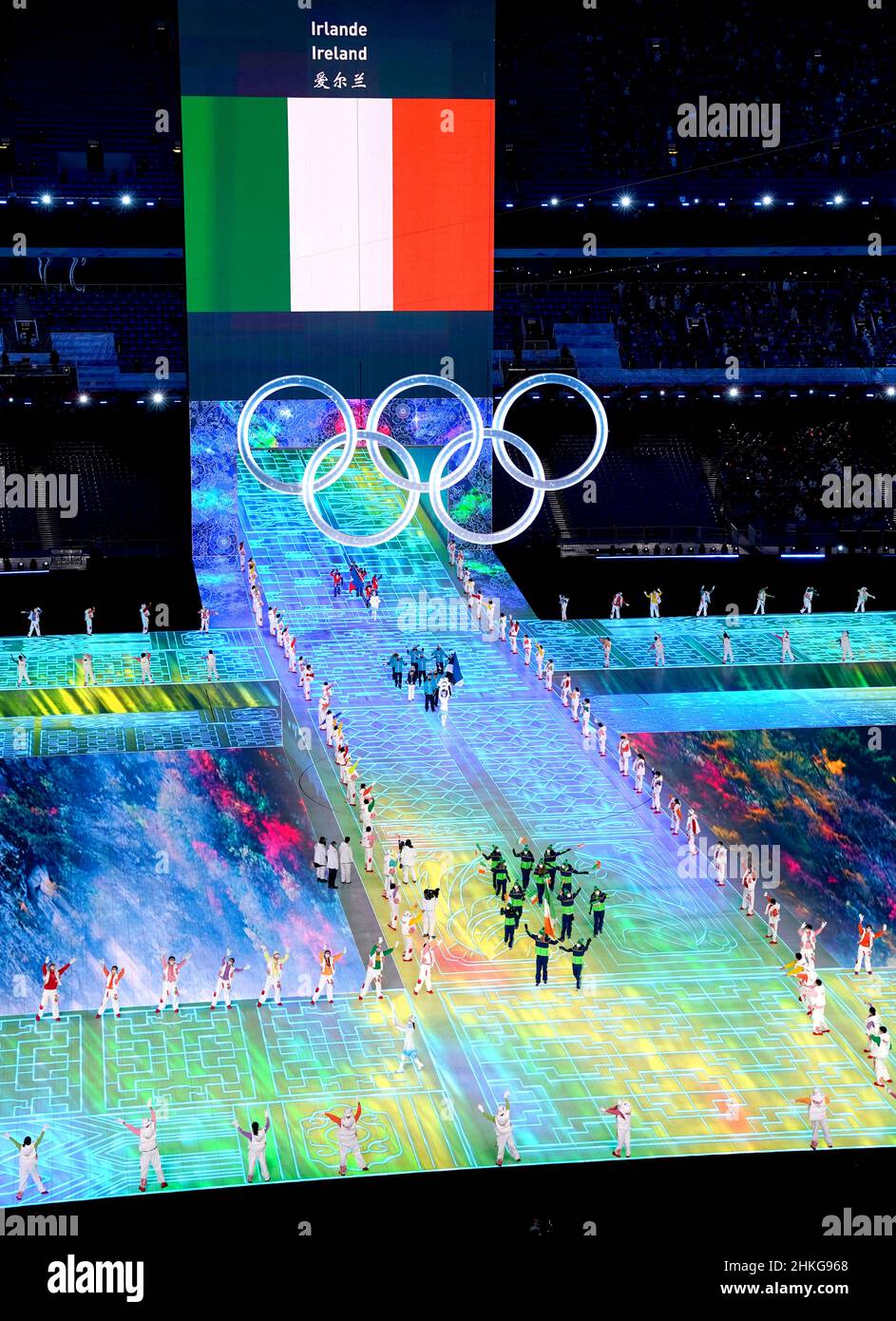 Ireland's flag bearers Brendan Newby and Elsa Desmond lead the team out ...