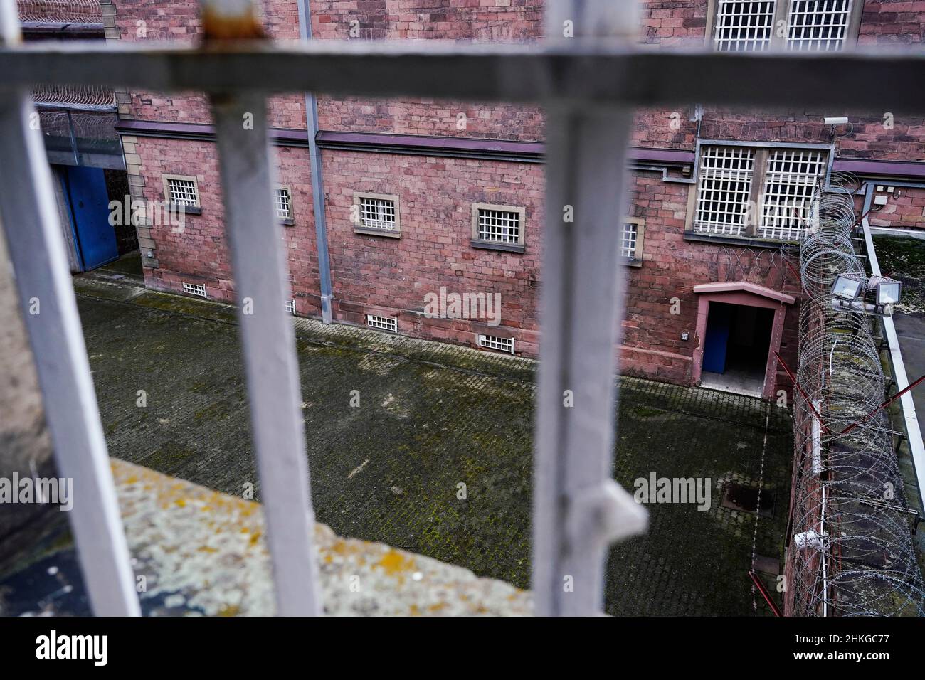 Heidelberg, Germany. 03rd Feb, 2022. Through a window grille, an inner ...