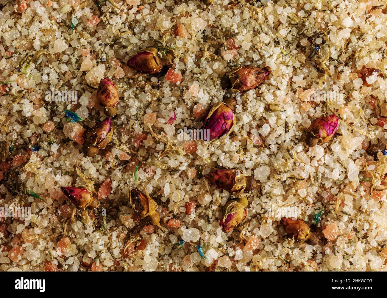 Bath salt with dried lavender and rose flowers. Salt background for spa ...