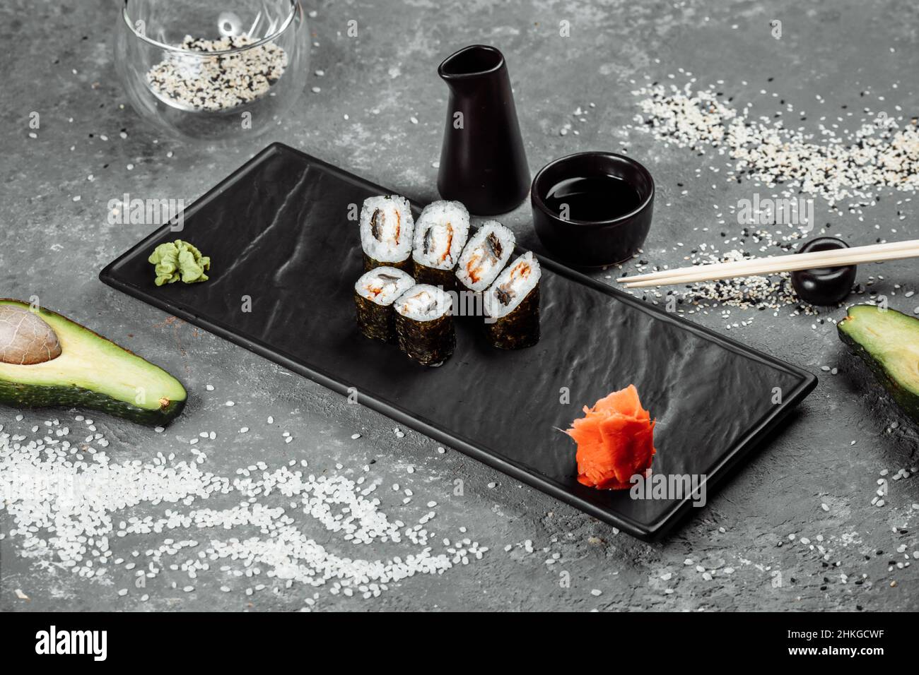 Simple maki with tuna. Sushi on a gray background Stock Photo - Alamy