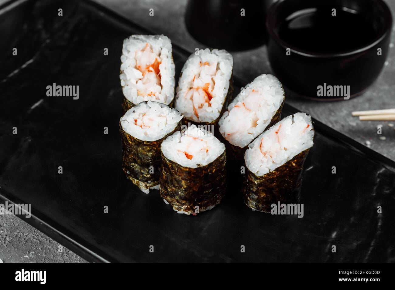 Simple maki with shrimp. Sushi on a gray background Stock Photo - Alamy