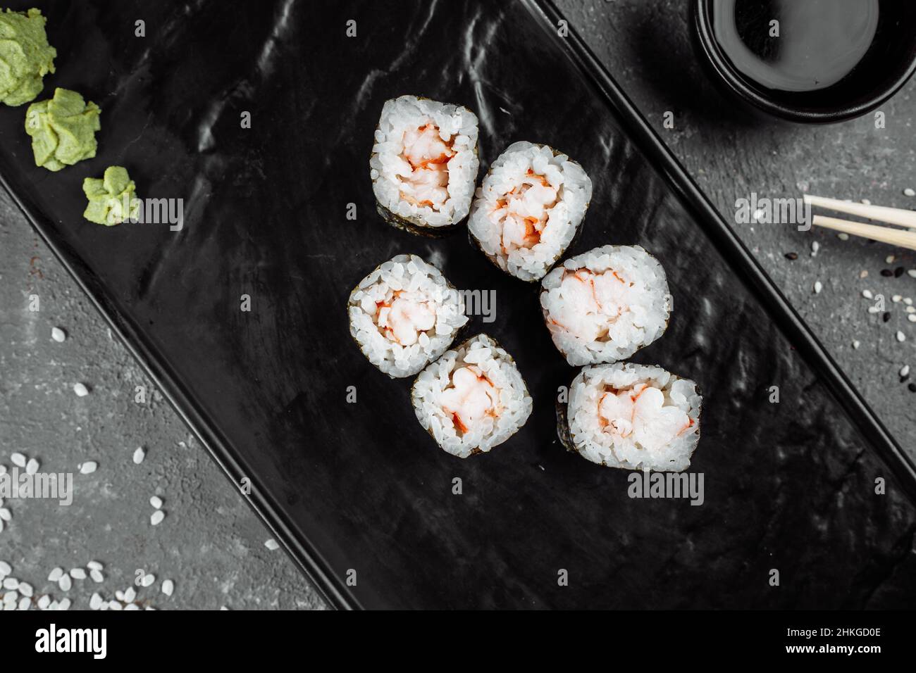 Simple maki with shrimp. Sushi on a gray background Stock Photo - Alamy