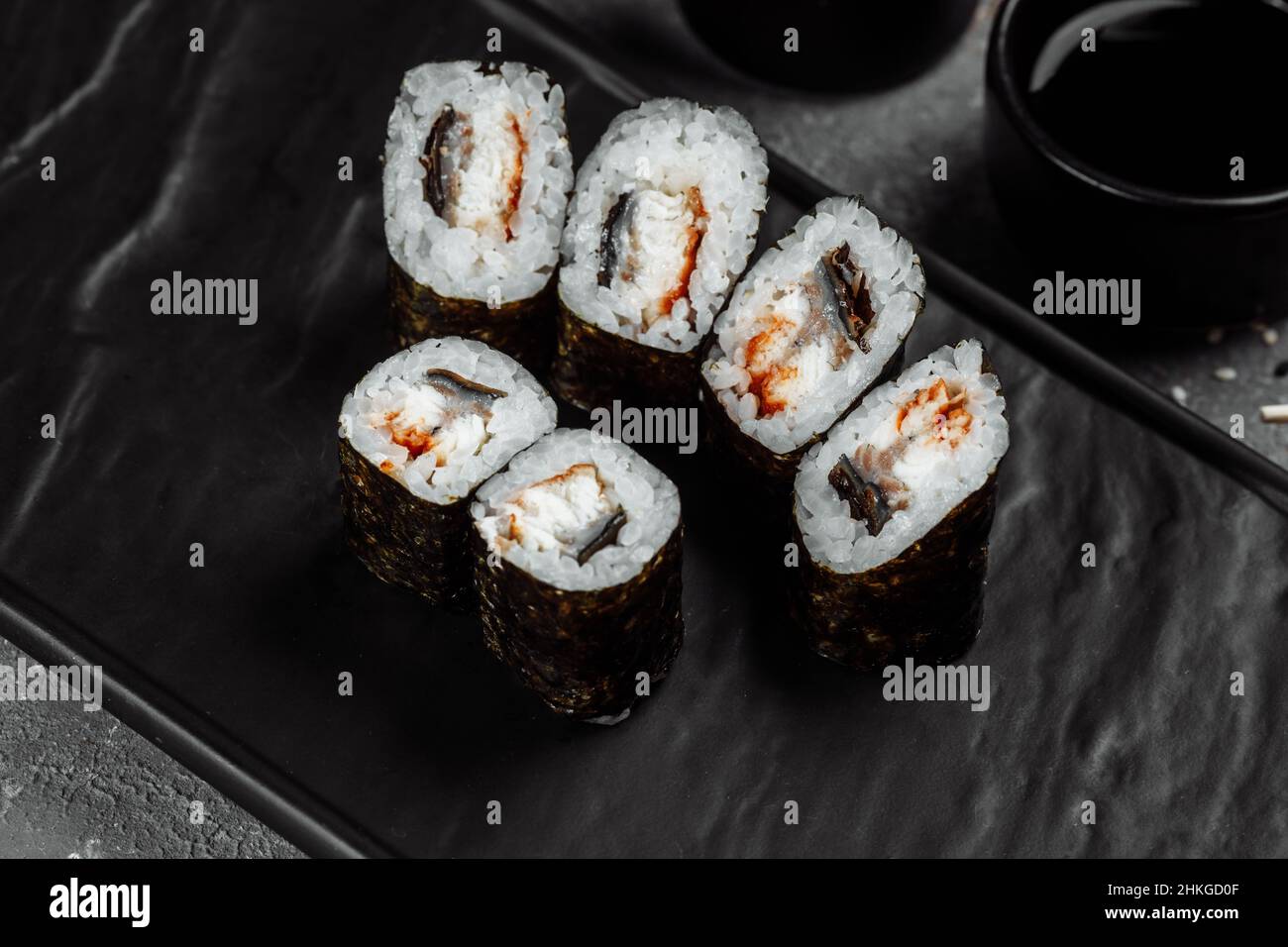 Simple maki with tuna. Sushi on a gray background Stock Photo - Alamy