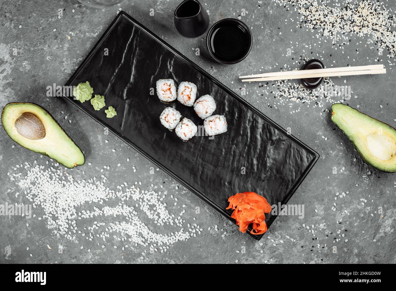 Simple maki with shrimp. Sushi on a gray background Stock Photo - Alamy