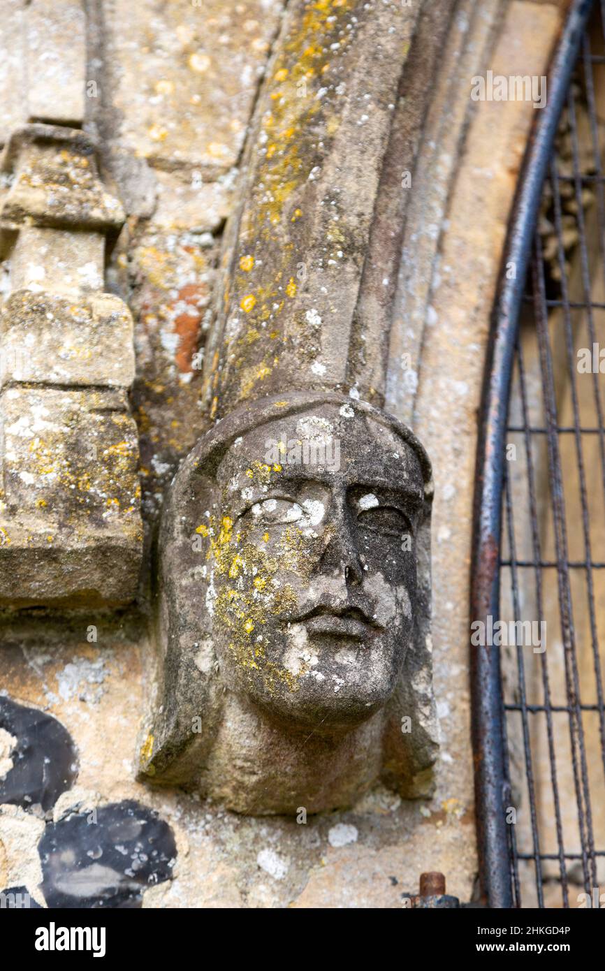 Carved stone face in porch of Oakley church, Suffolk, England, UK Stock ...