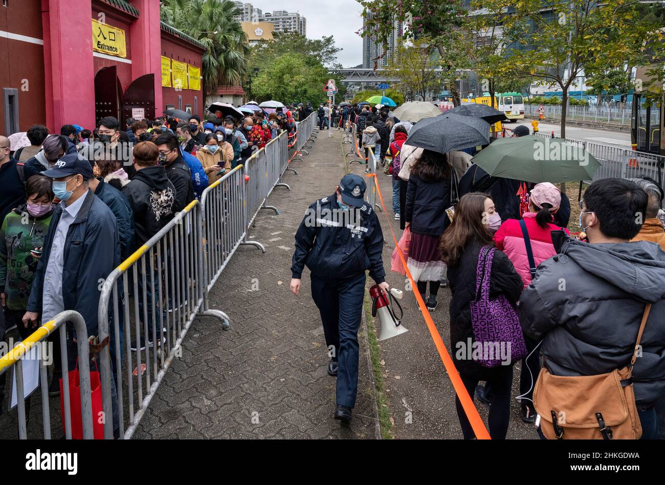 Worshippers queue in line to enter the Sha Tin Che Kung temple on the ...
