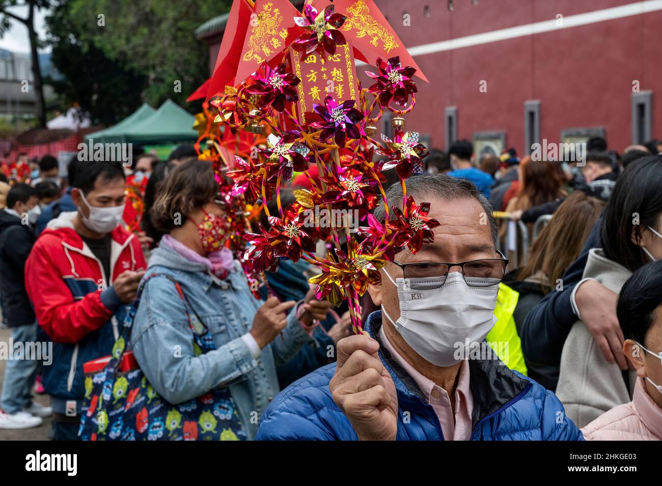 Worshippers queue in line to enter the Sha Tin Che Kung temple on the ...