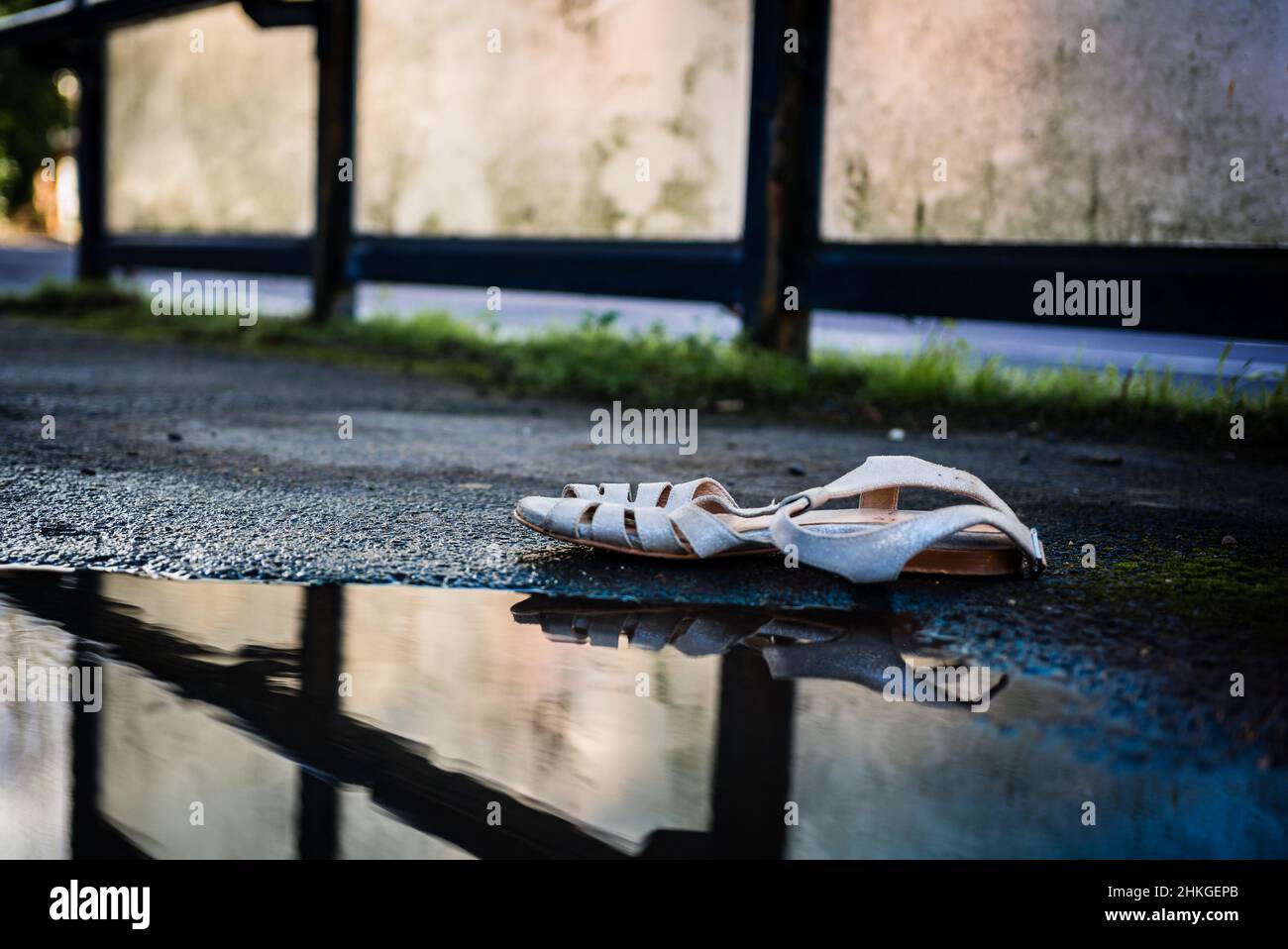 lost shoe at a bus stop Stock Photo - Alamy