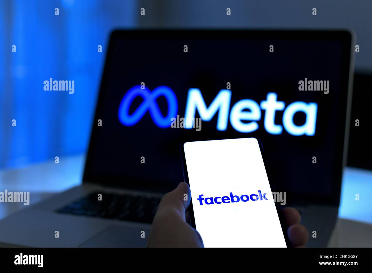 Laptop and smartphone with Meta and Facebook logo on display. New Mark ...