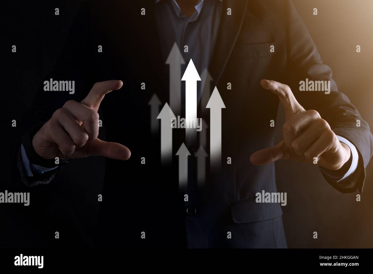 Business man holding holographic graphs and stock market statistics ...