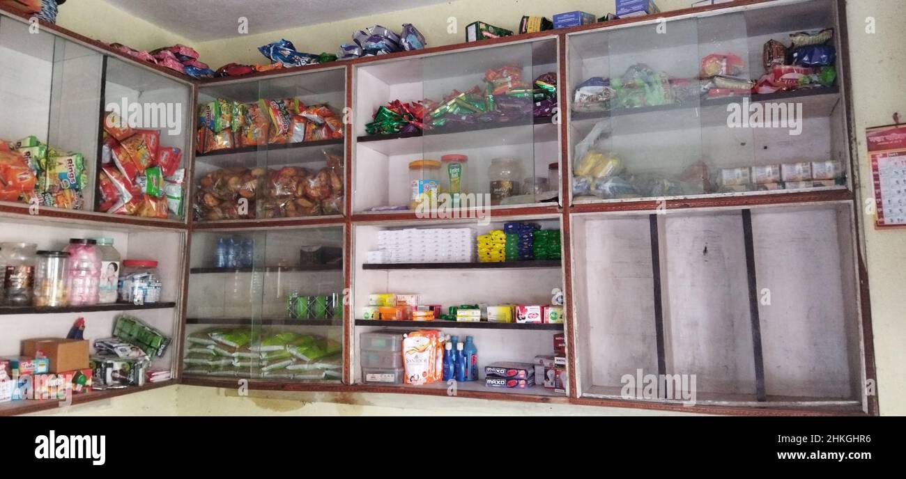 All kinds of groceries and general items on the rack in the store in ...