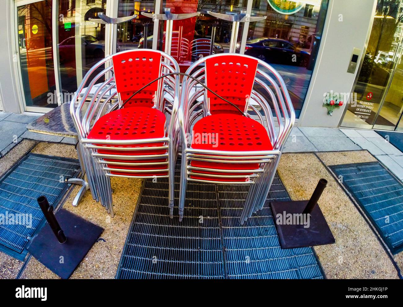 Stacked outdoor seating at a closed restaurant Stock Photo - Alamy
