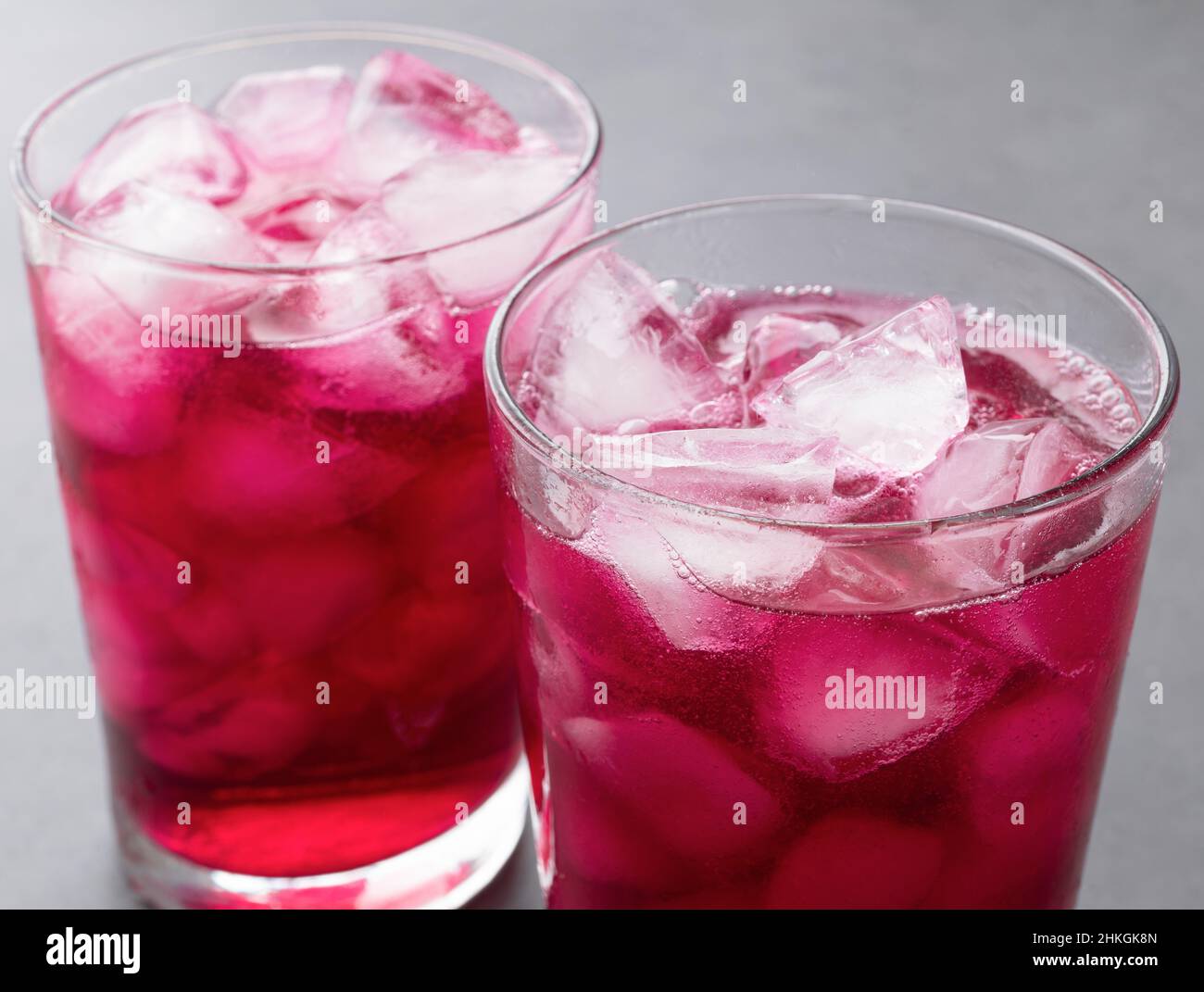 Grape soda, soft drink in cups with ice Stock Photo - Alamy