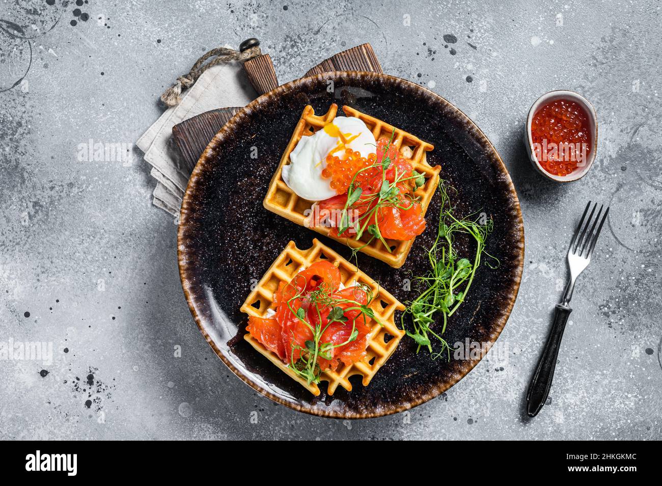 Belgian waffle with cream cheese, salmon slices, egg and red caviar ...