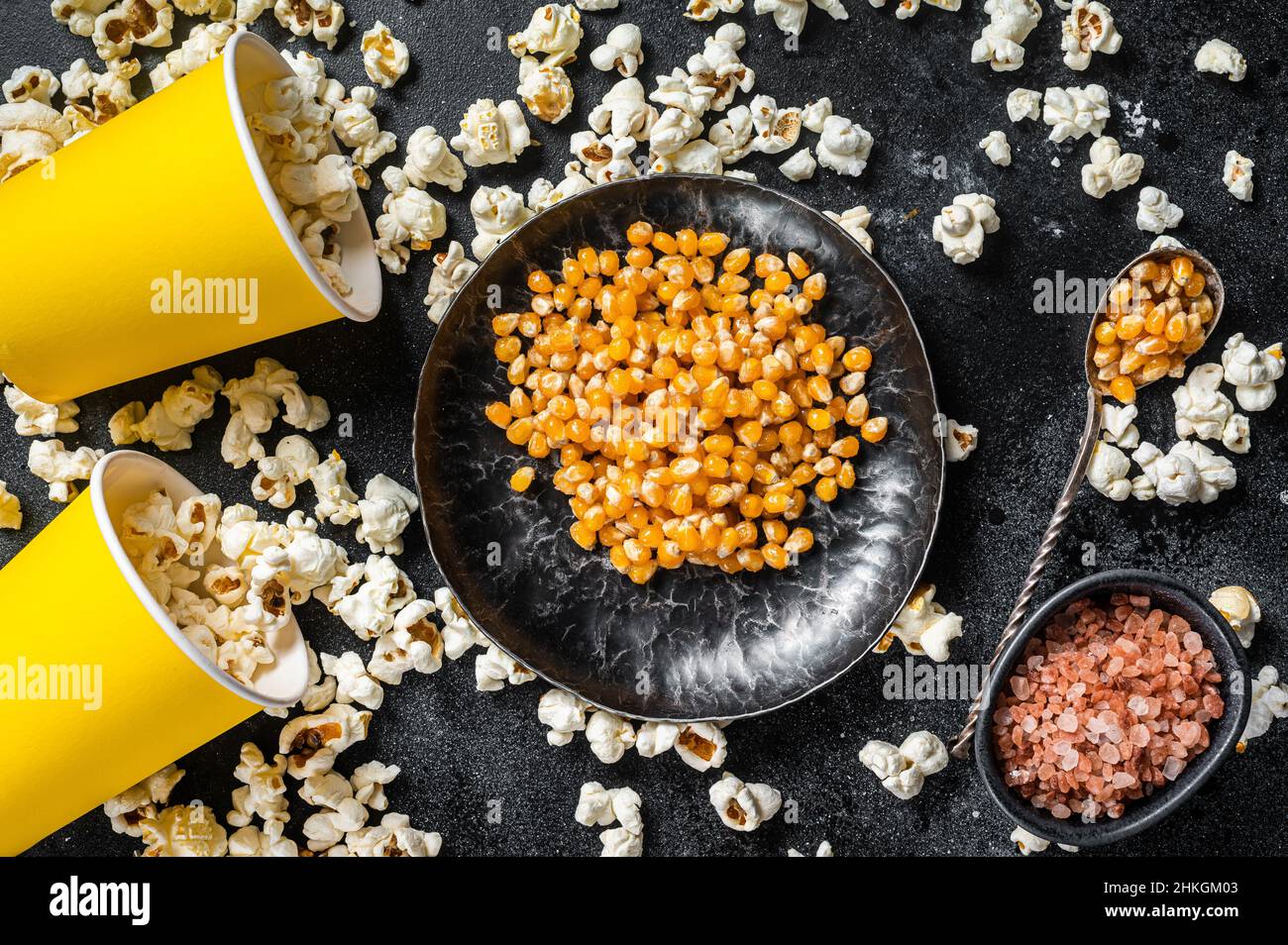 Buttered Salted popcorn with corn kernel and salt. Black background ...