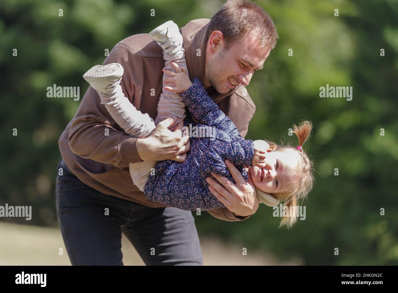Father lifting up daughter on hi-res stock photography and images - Alamy