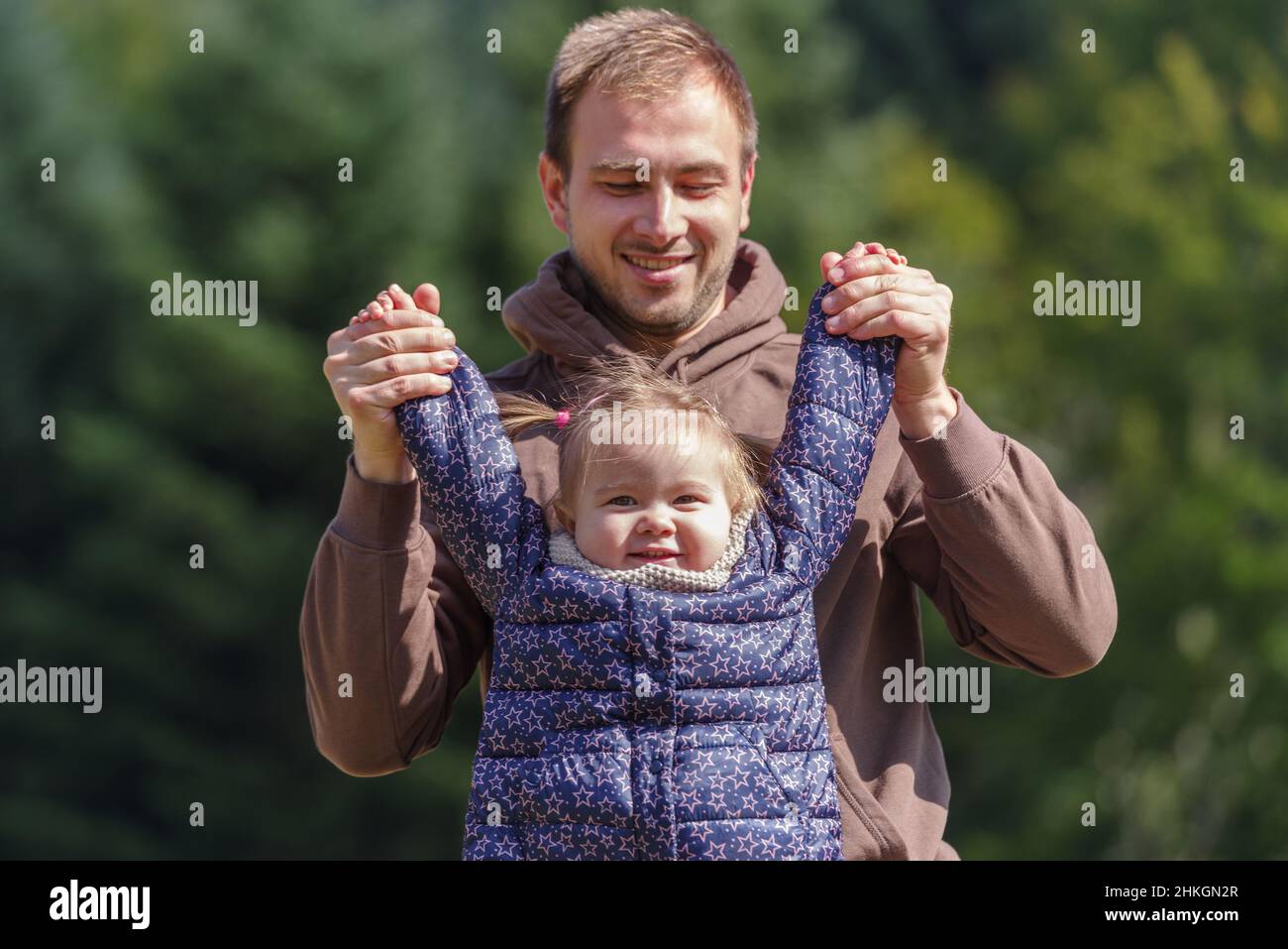 Father lifting up daughter on hi-res stock photography and images - Alamy