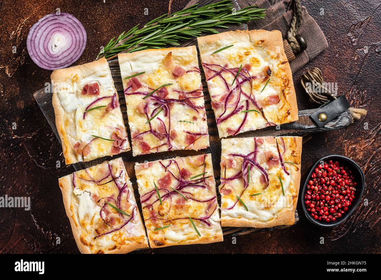 French tarte flambee with cream cheese, bacon and onions. Flammkuchen ...