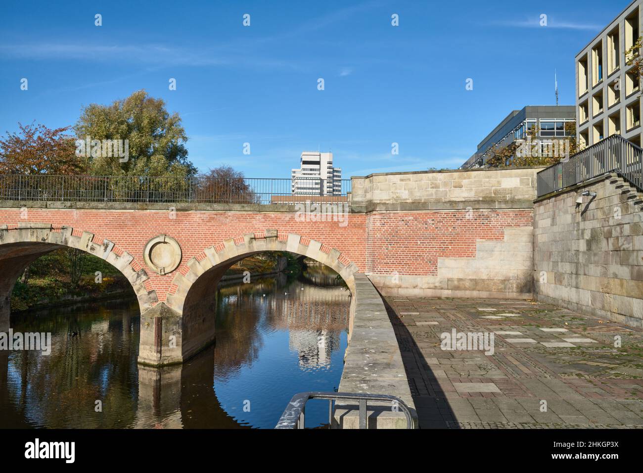 River bank with an old brick bridge and bank reinforcement Stock Photo ...