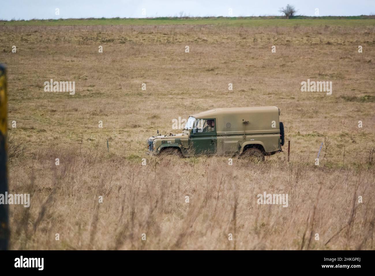land rover defender wolf army medium utility vehicle on a military ...